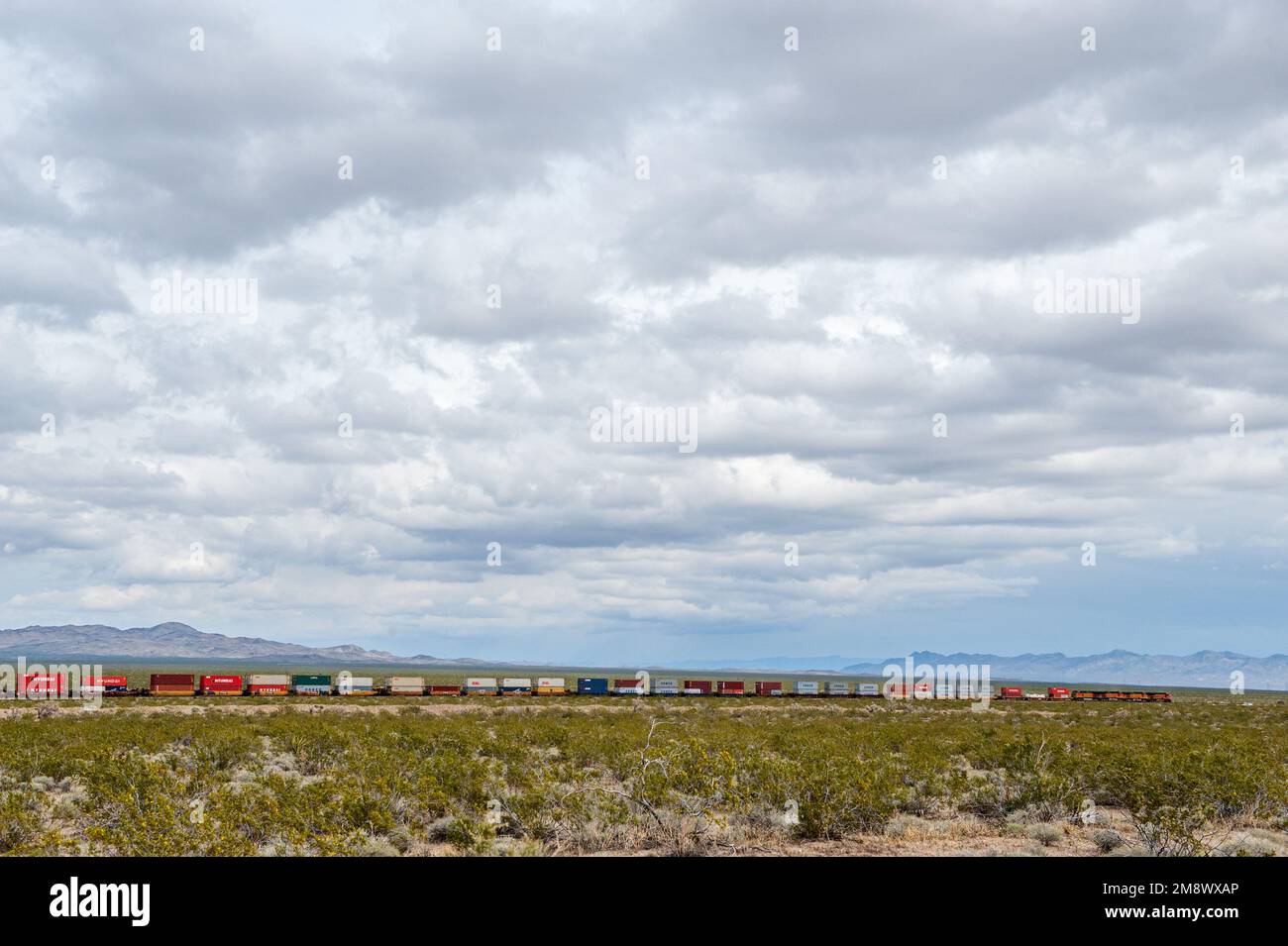 Long cargo train running through the Mojave desert in Nevada Stock ...