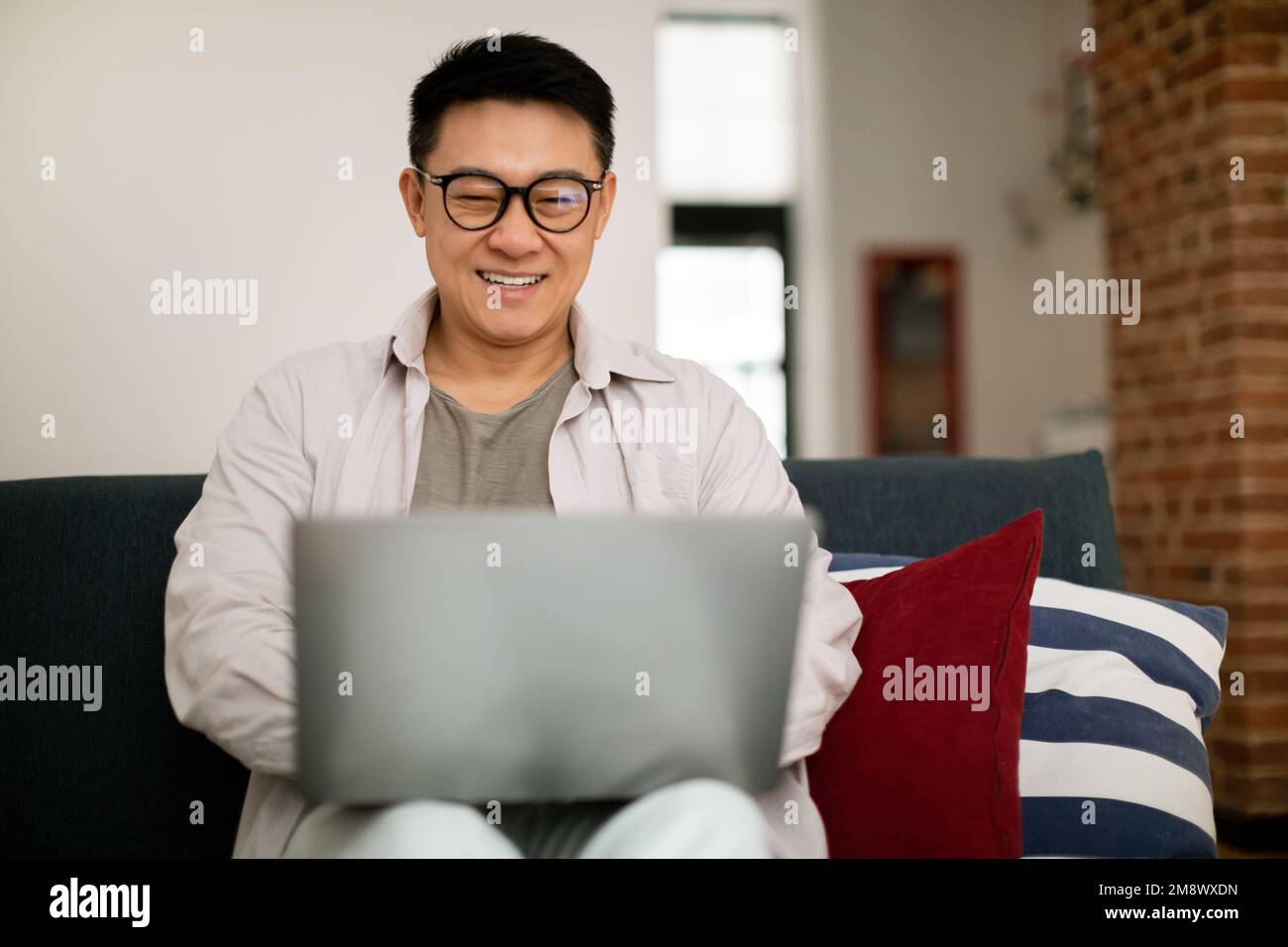 Cheerful middle aged asian man hi-res stock photography and images - Alamy