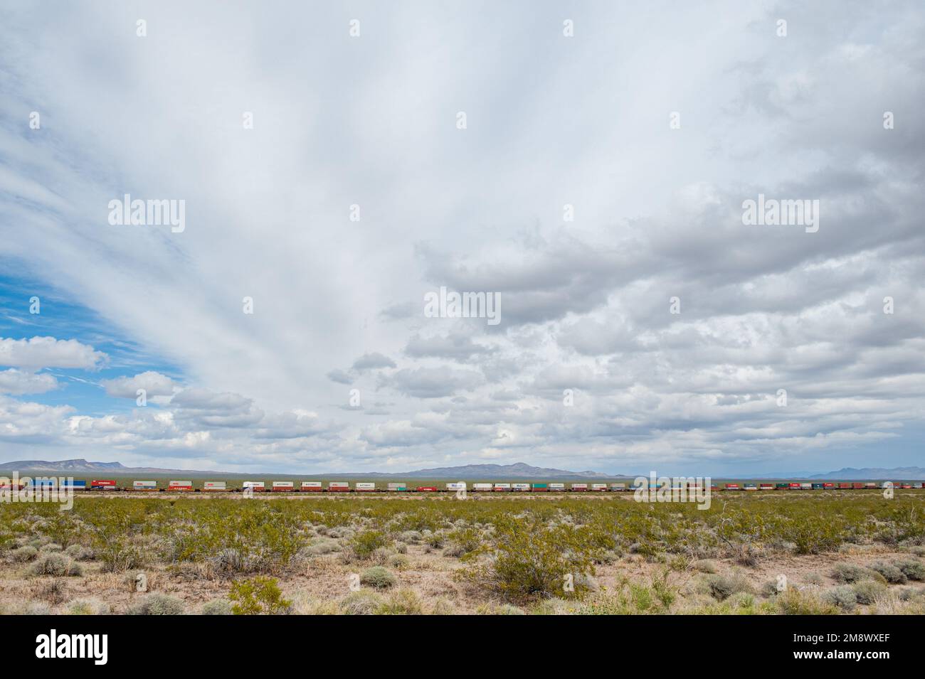 Long cargo train running through the Mojave desert in Nevada Stock ...