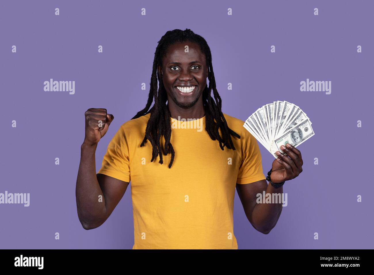 Emotional african american guy showing cash dollars and gesturing Stock ...