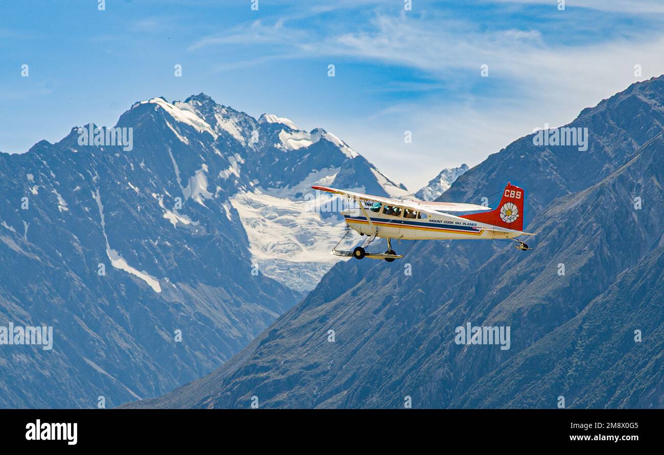A ski plane taking off at Mount Cook Airport with tourists on a scenic ...
