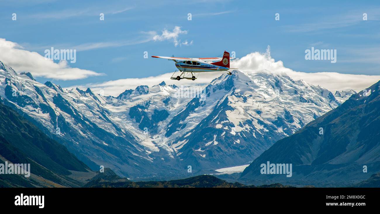 A ski plane taking off at Mount Cook Airport with tourists on a scenic ...