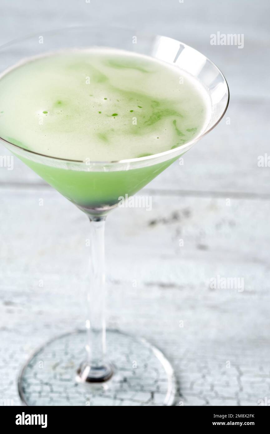 Japanese Slipper Cocktail in martini glass garnished with cherry Stock ...