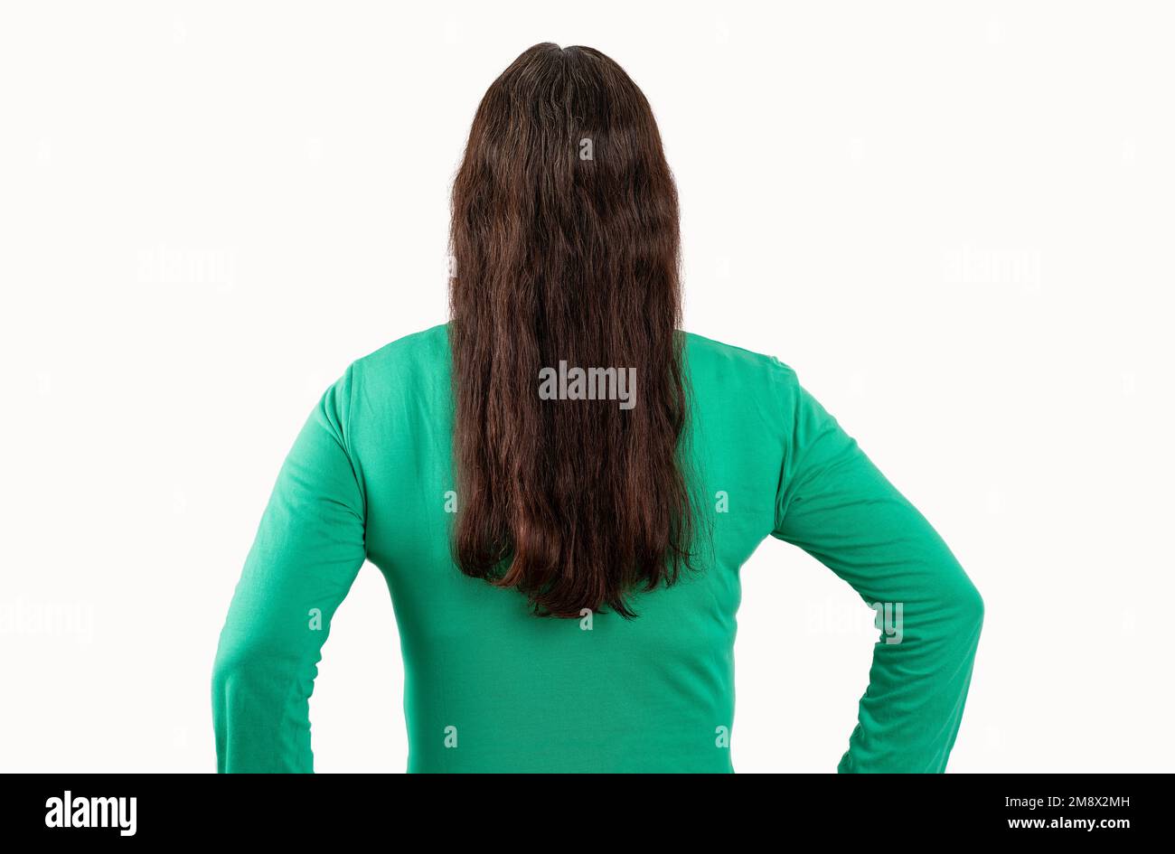 Young Beautiful Woman Wearing Green T Shirt Standing Over White