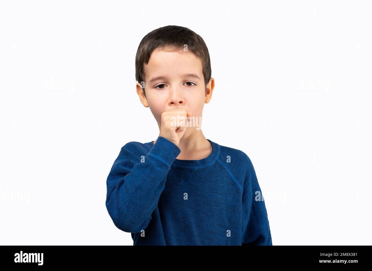Young little boy kid wearing blue shirt standing over isolated ...