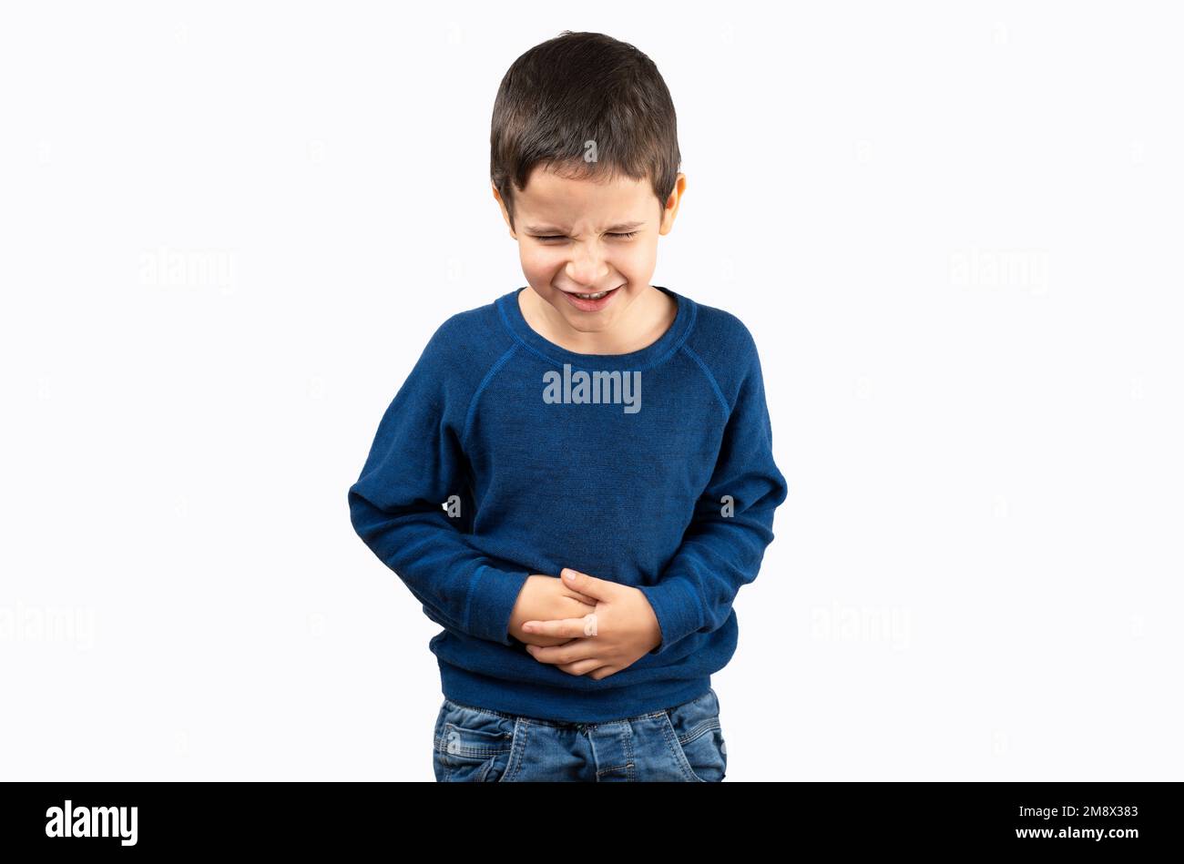 Young little boy kid wearing blue shirt standing over white isolated ...