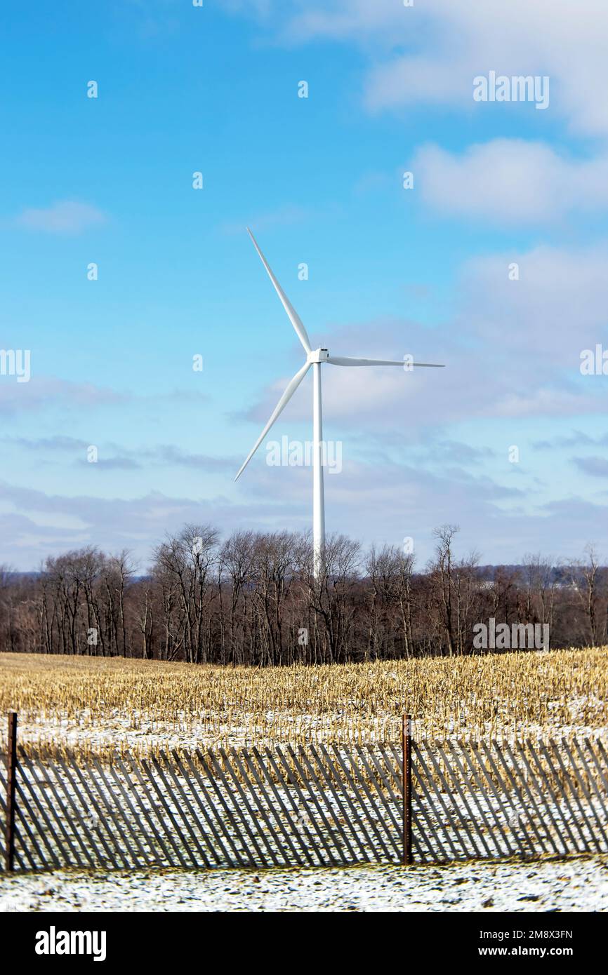 Part of a windmill farm for natural or green energy along a state road ...