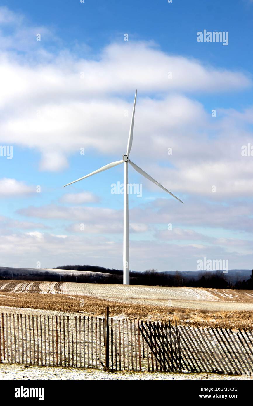 Part of a windmill farm for natural or green energy along a state road ...