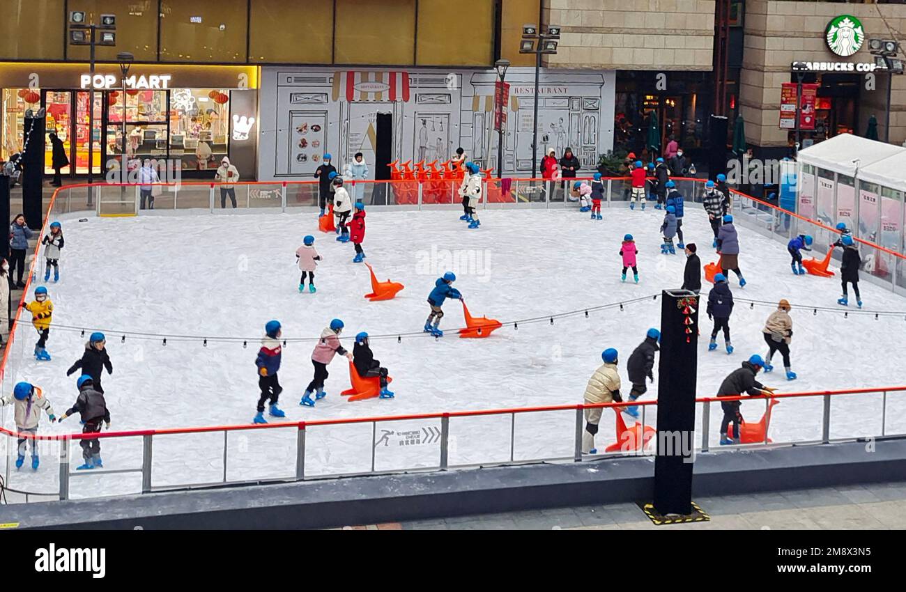 SHANGHAI, CHINA - JANUARY 15, 2023 - People and children skate at an ...