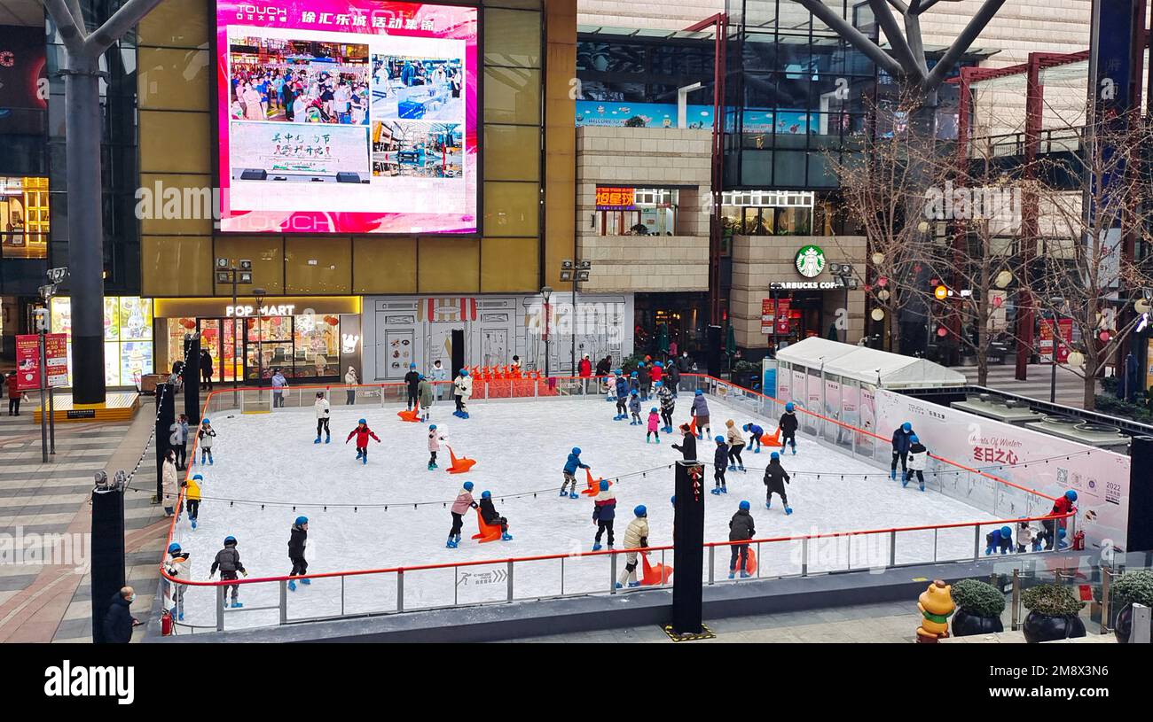 SHANGHAI, CHINA - JANUARY 15, 2023 - People and children skate at an ...