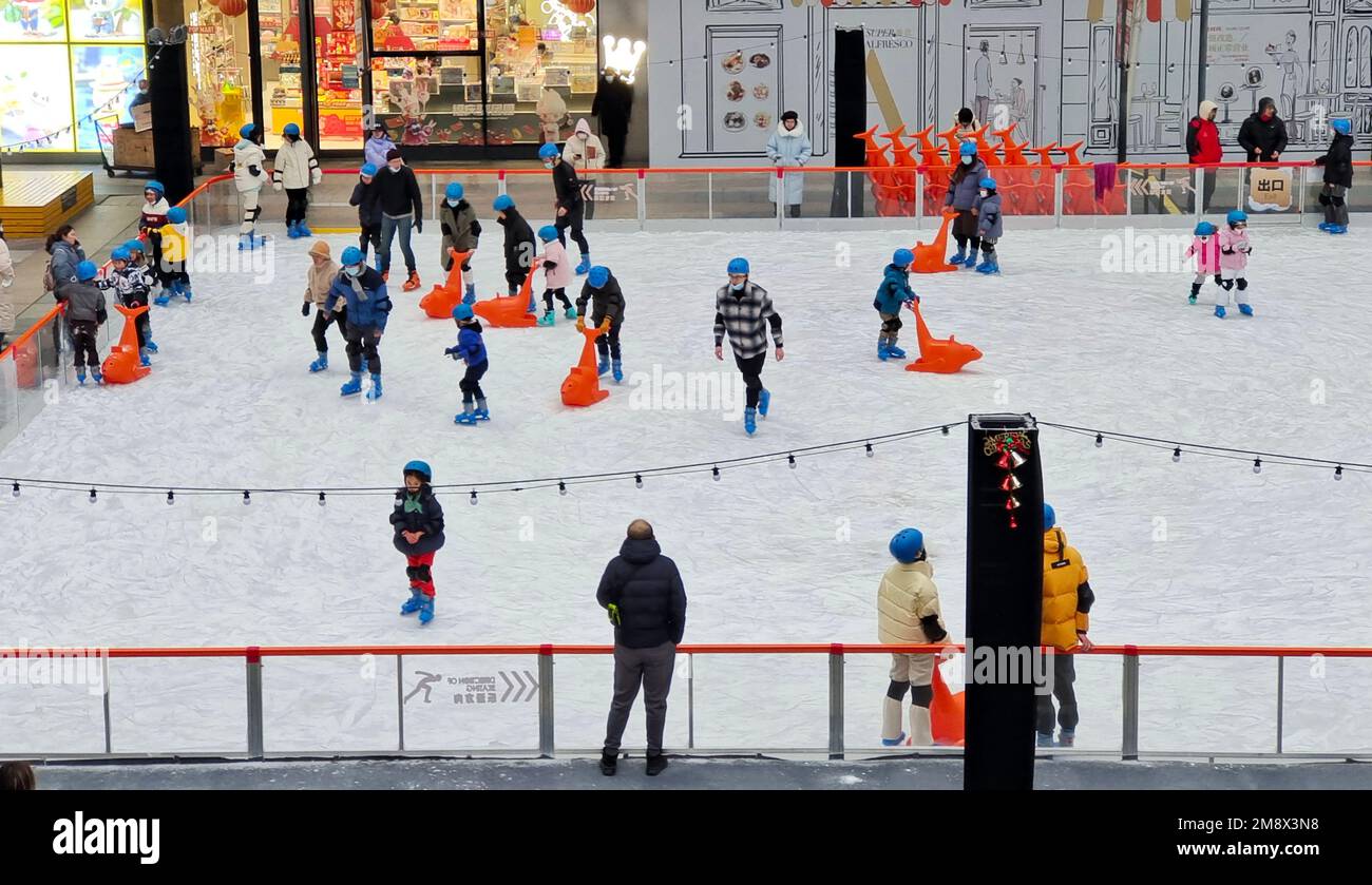 SHANGHAI, CHINA - JANUARY 15, 2023 - People and children skate at an ...