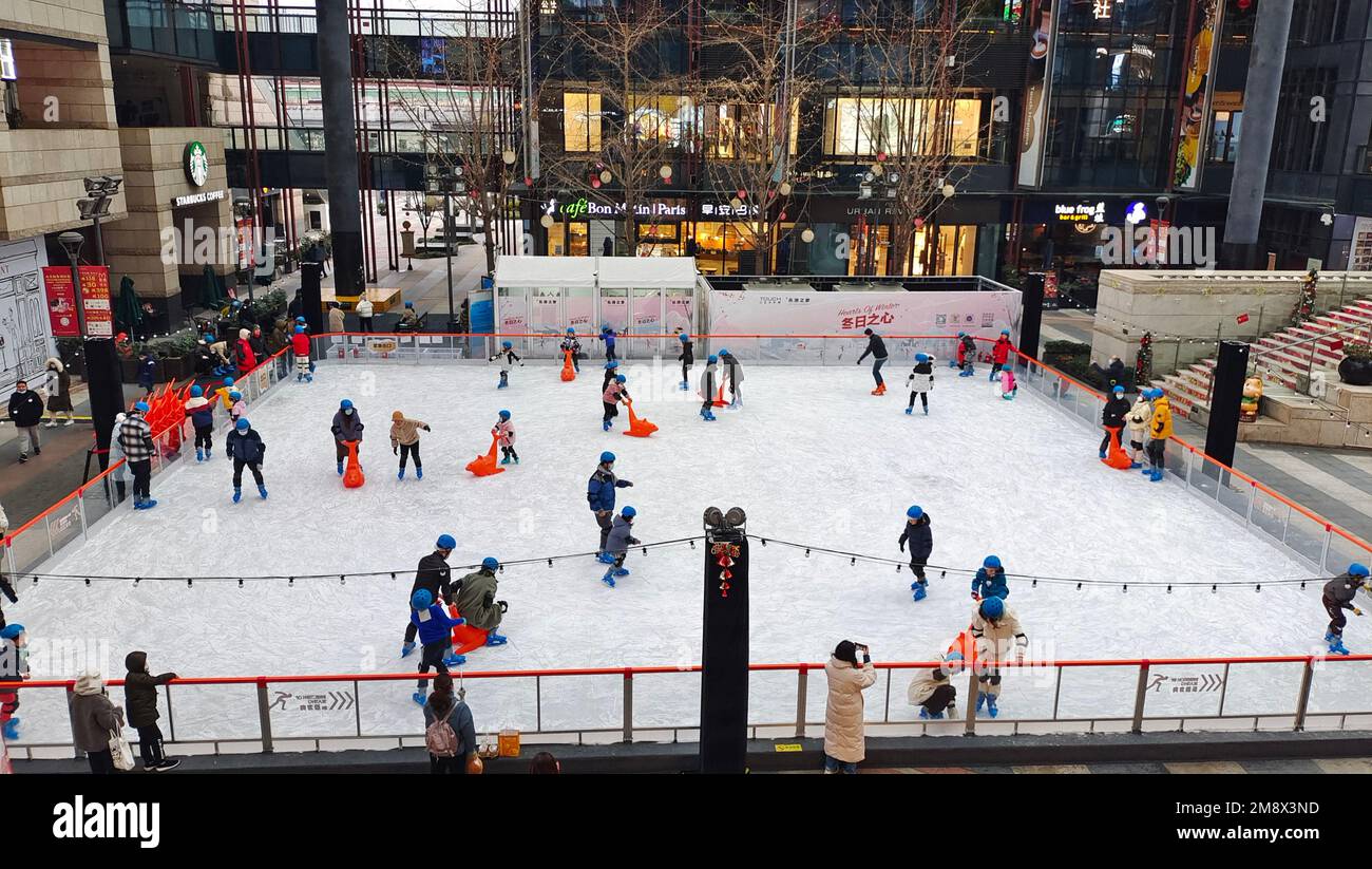 SHANGHAI, CHINA - JANUARY 15, 2023 - People and children skate at an ...