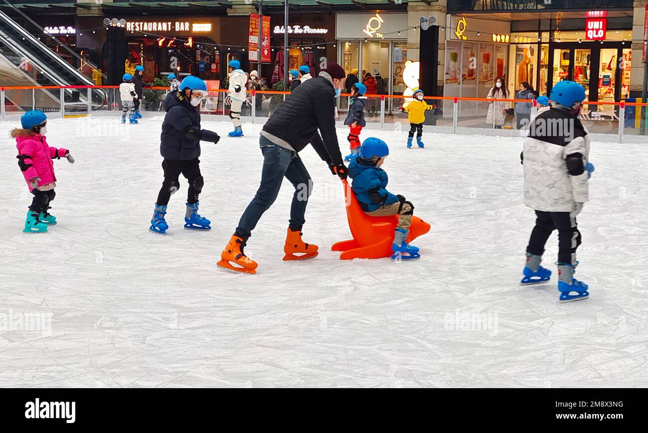SHANGHAI, CHINA - JANUARY 15, 2023 - People and children skate at an ...