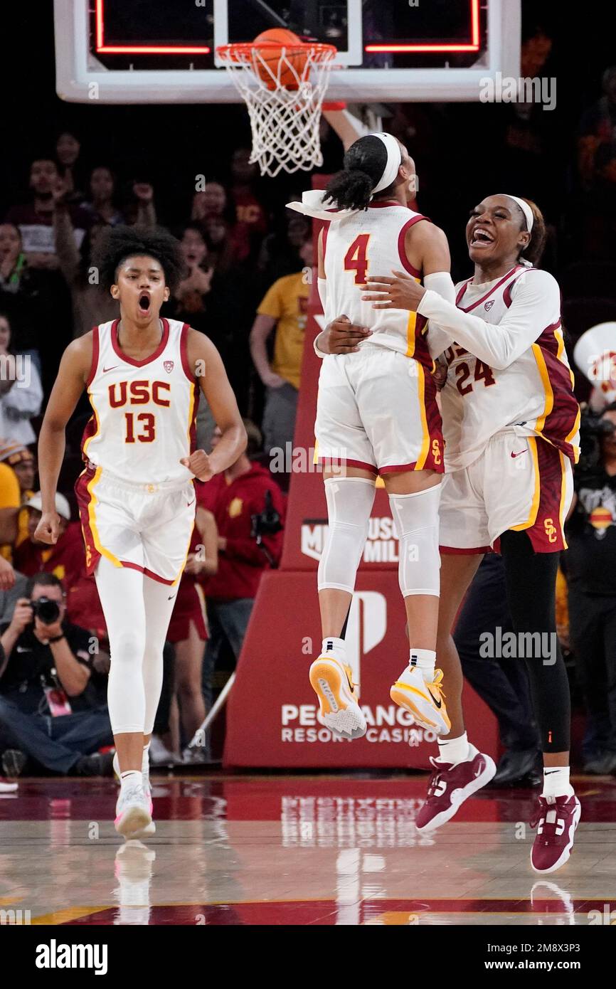 Southern California guard Kayla Williams, center, and guard Okako Adika ...