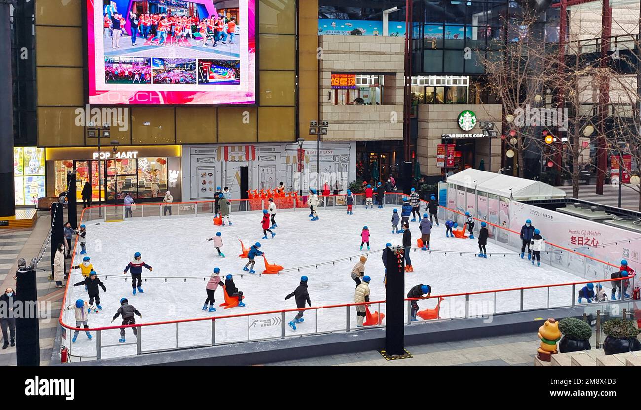 SHANGHAI, CHINA - JANUARY 15, 2023 - People and children skate at an ...