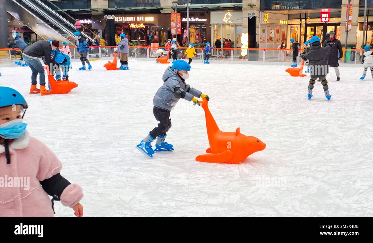 SHANGHAI, CHINA - JANUARY 15, 2023 - People and children skate at an ...