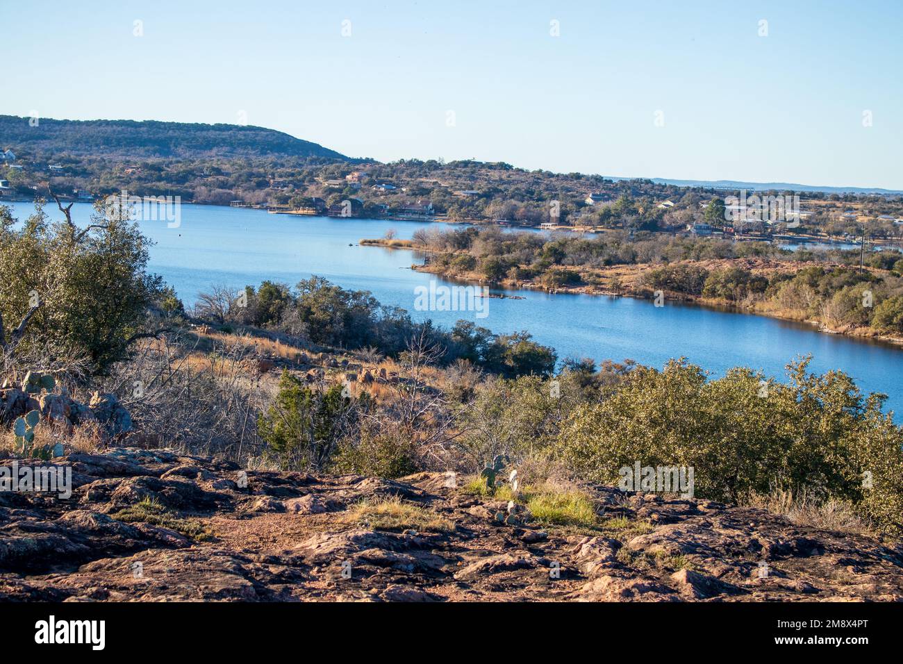 Texas Hill Country hiking trail with a panoramic view of Inks Lake. A ...