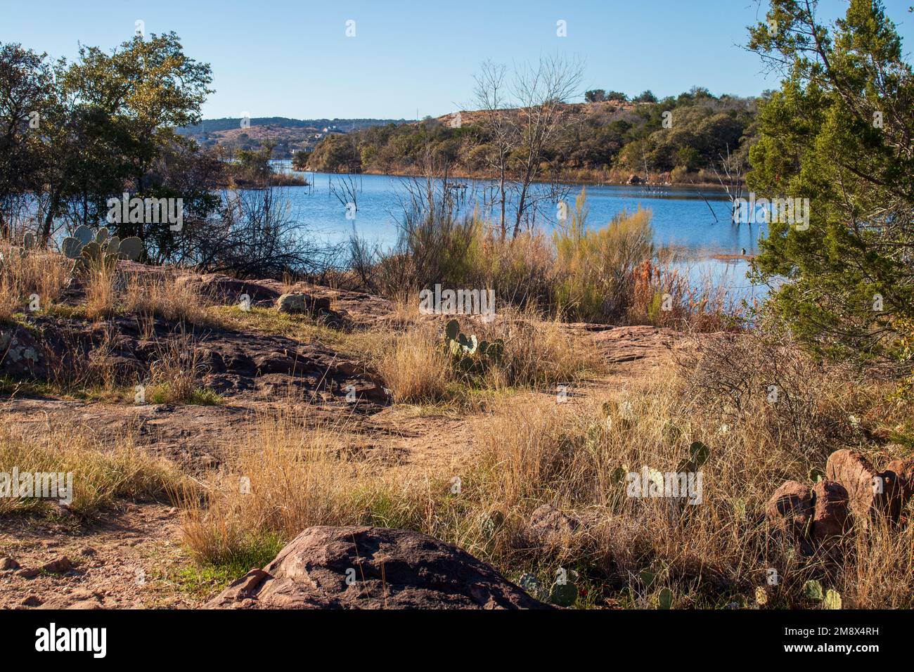 Texas Hill Country hiking trail with a view of Inks Lake. The path ...
