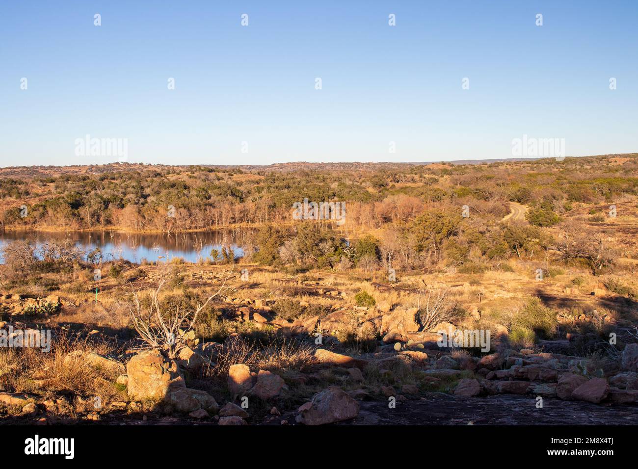 Texas Hill Country hiking trail with a view of Inks Lake. The ...