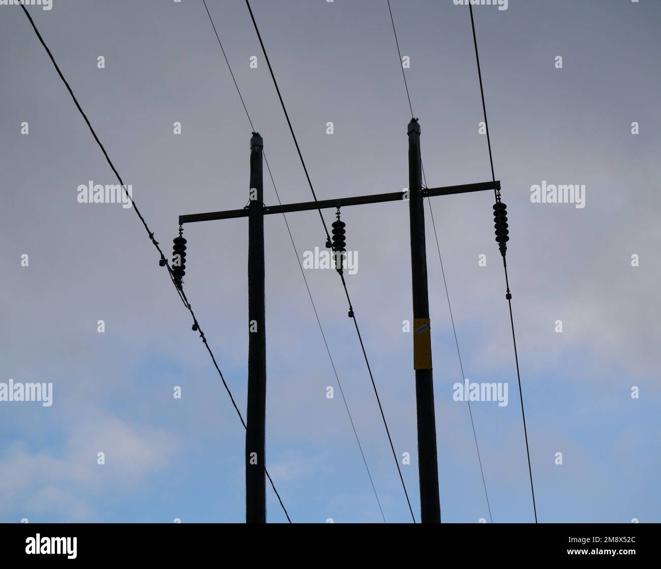 Low angle view of electricity pylon against sky Stock Photo - Alamy