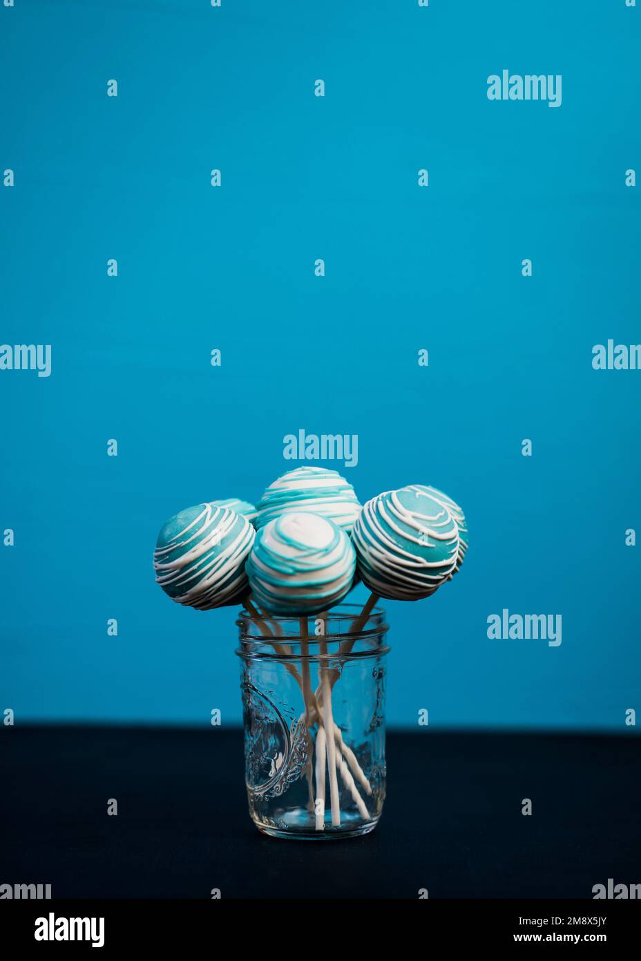 Teal and white cake pops Stock Photo - Alamy