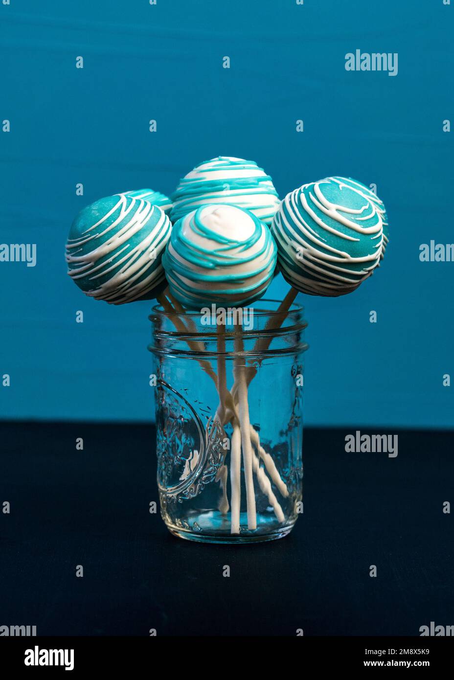 Teal and white cake pops Stock Photo - Alamy