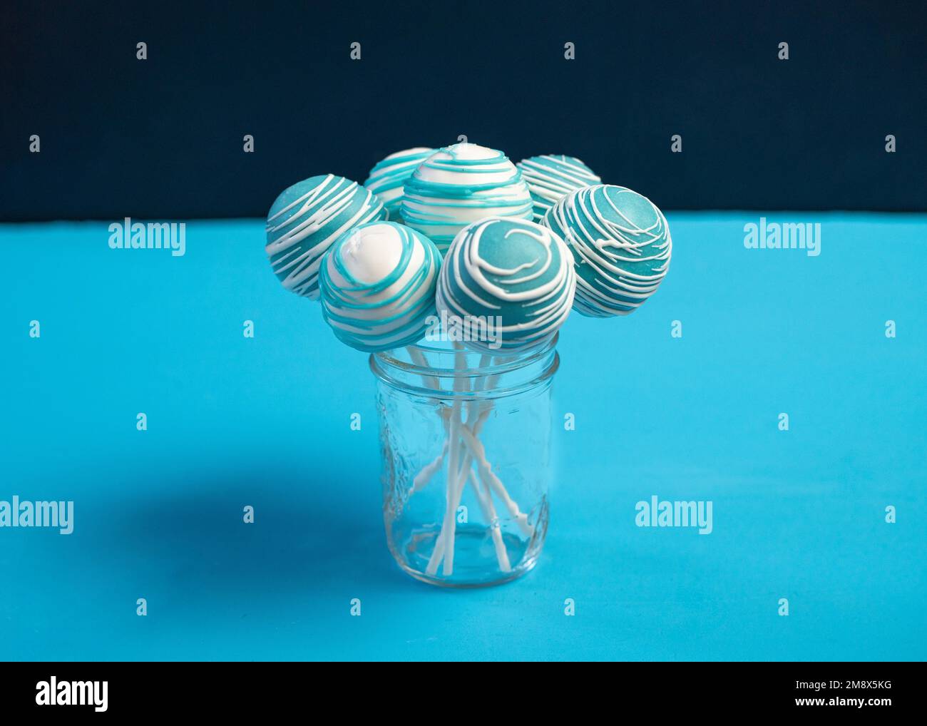 Teal and white cake pops Stock Photo - Alamy