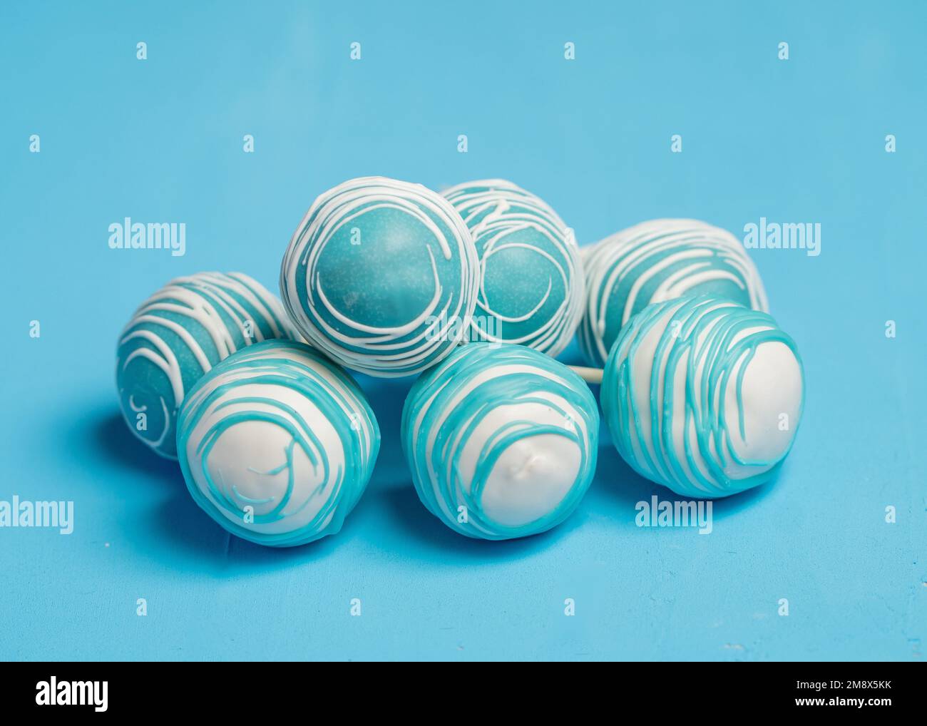 Teal and white cake pops Stock Photo - Alamy