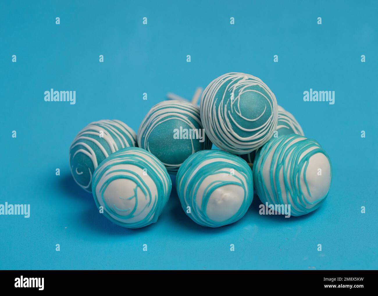 Teal and white cake pops Stock Photo - Alamy