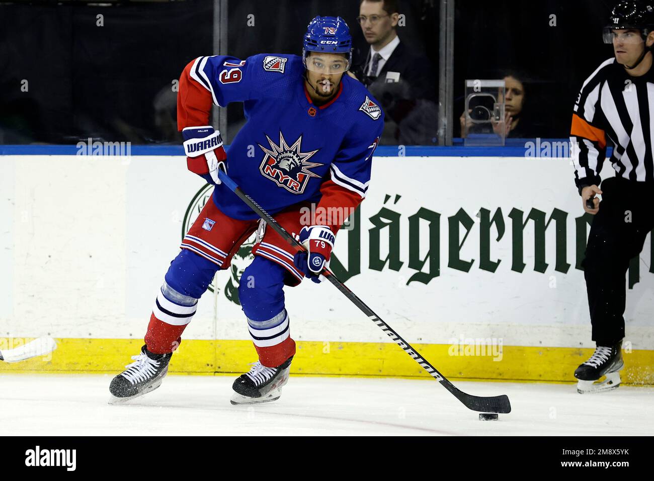 New York Rangers defenseman K'Andre Miller (79) skates against the ...