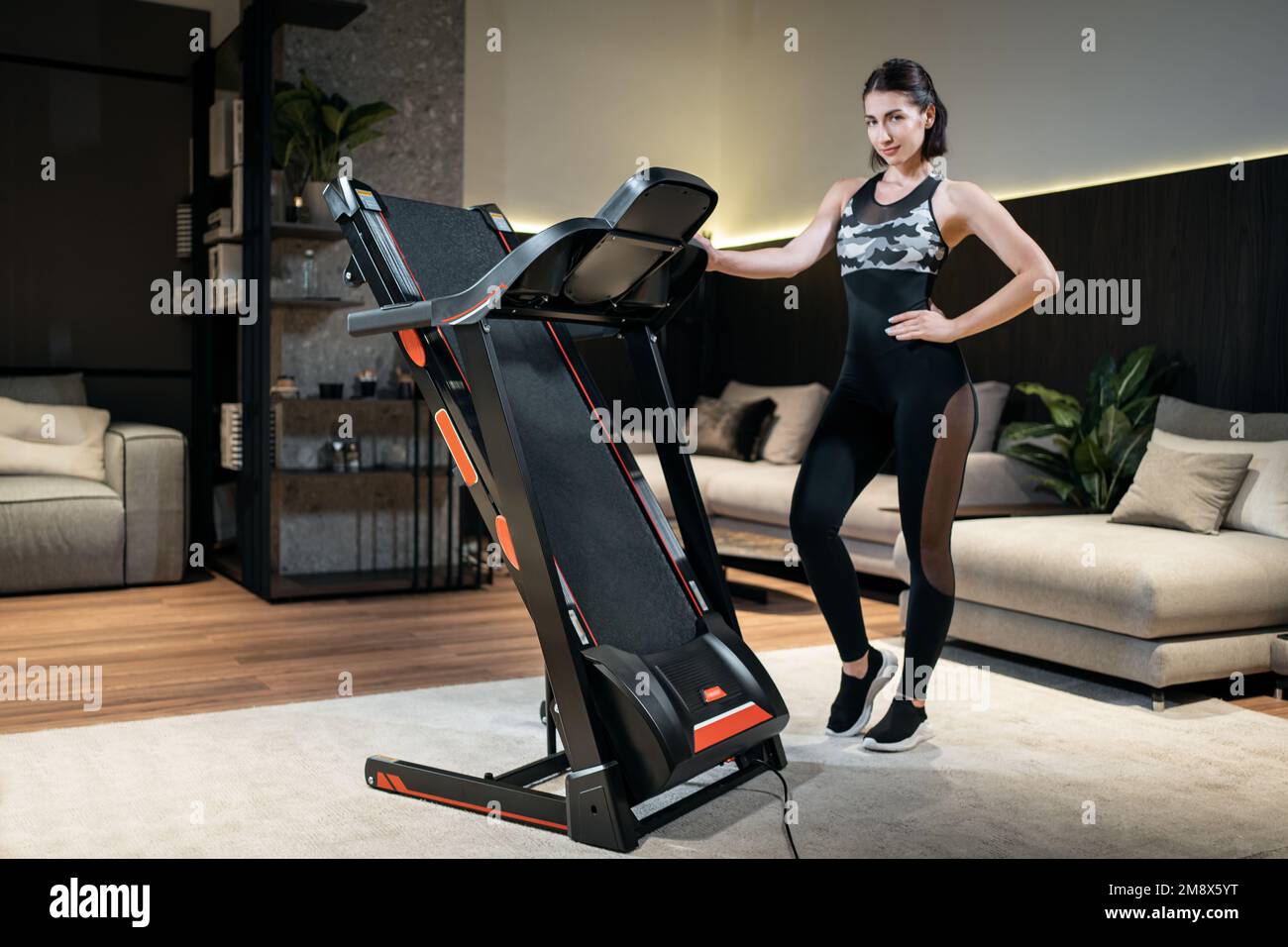 female athlete prepare for training with treadmill Stock Photo - Alamy