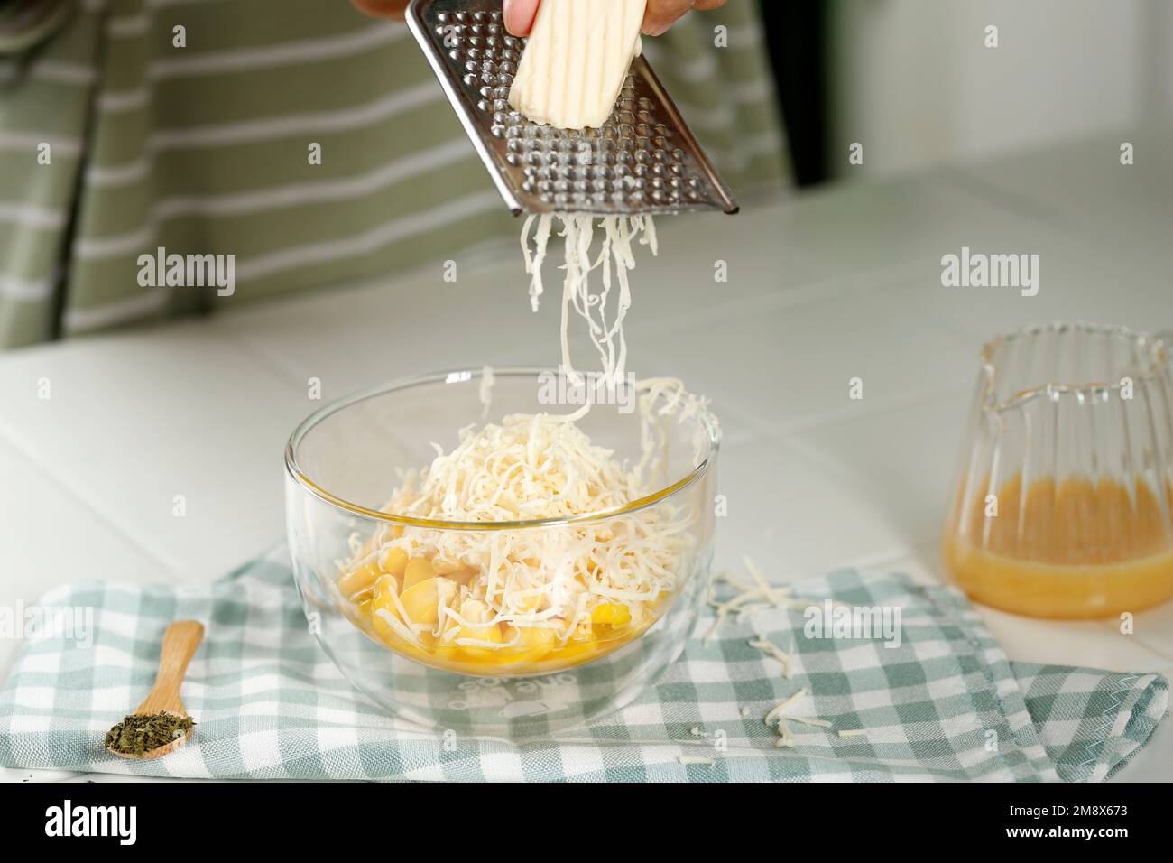 Kids Shredded Cheese on Jasuke Sweet Corn, on White Table Stock Photo ...