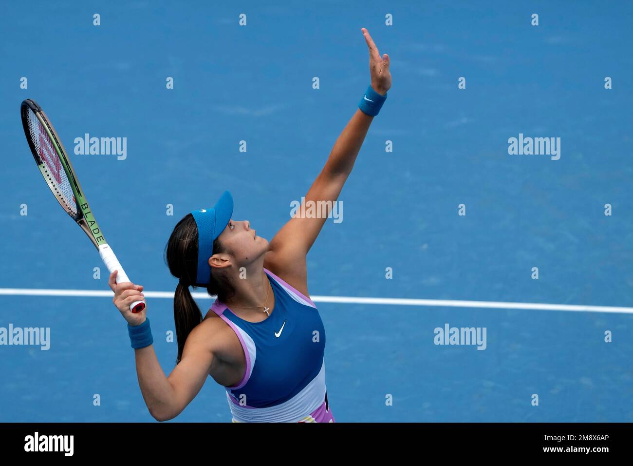 Emma Raducanu of Britain serves to Tamara Korpatsch of Germany during their first round match at ...