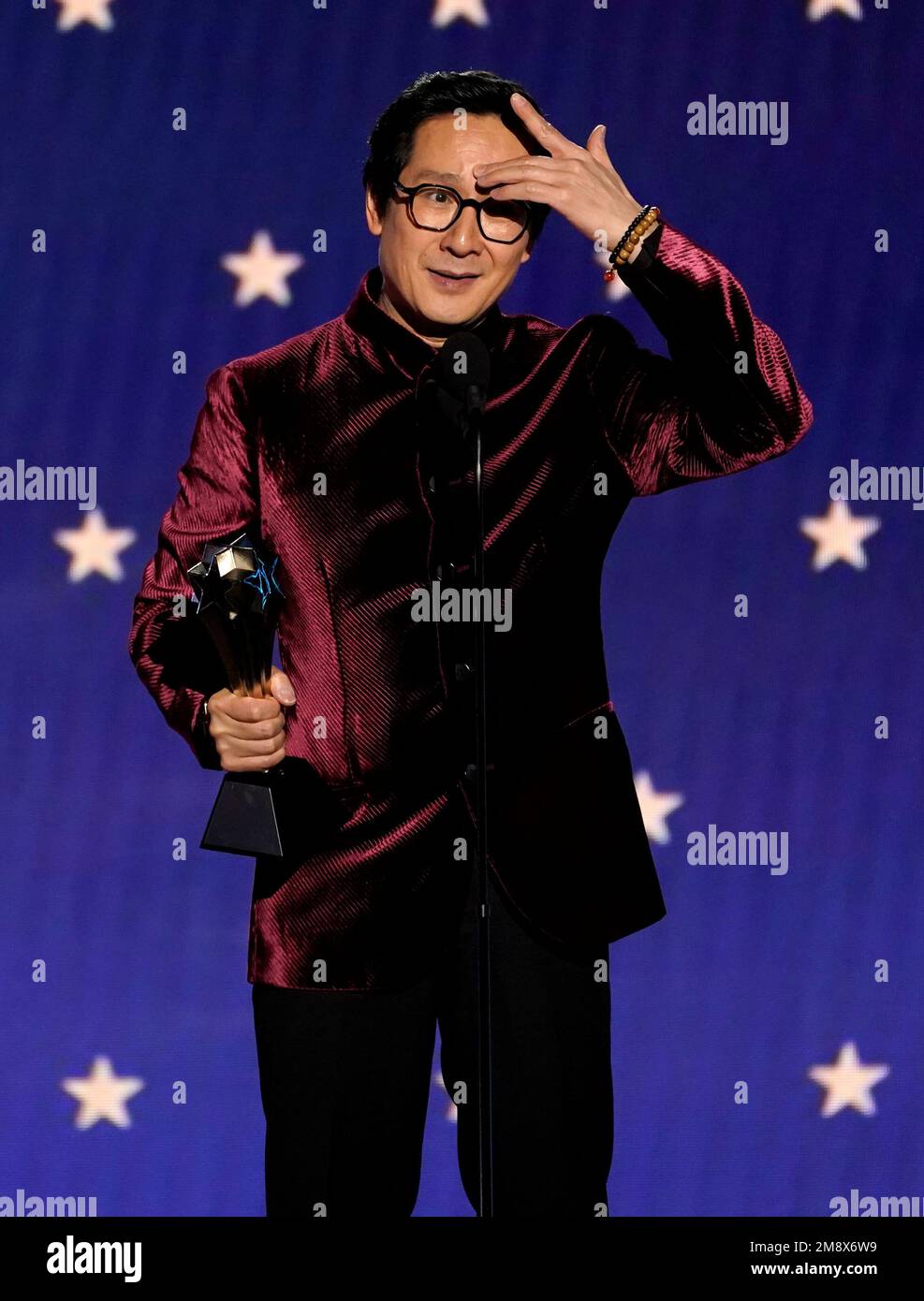 Ke Huy Quan accepts the award for best supporting actor for "Everything ...