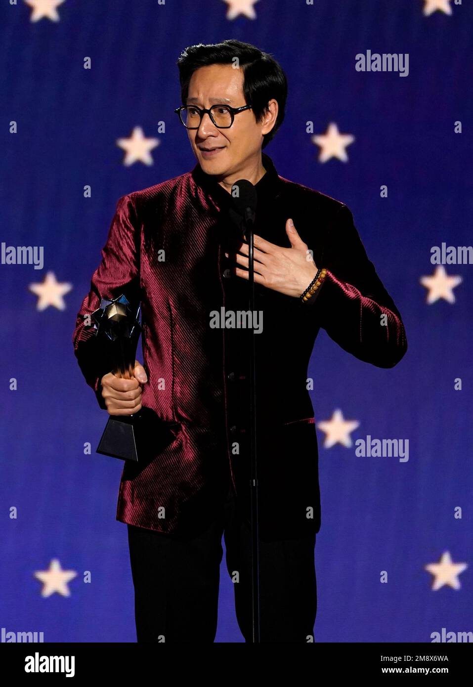 Ke Huy Quan accepts the award for best supporting actor for "Everything ...