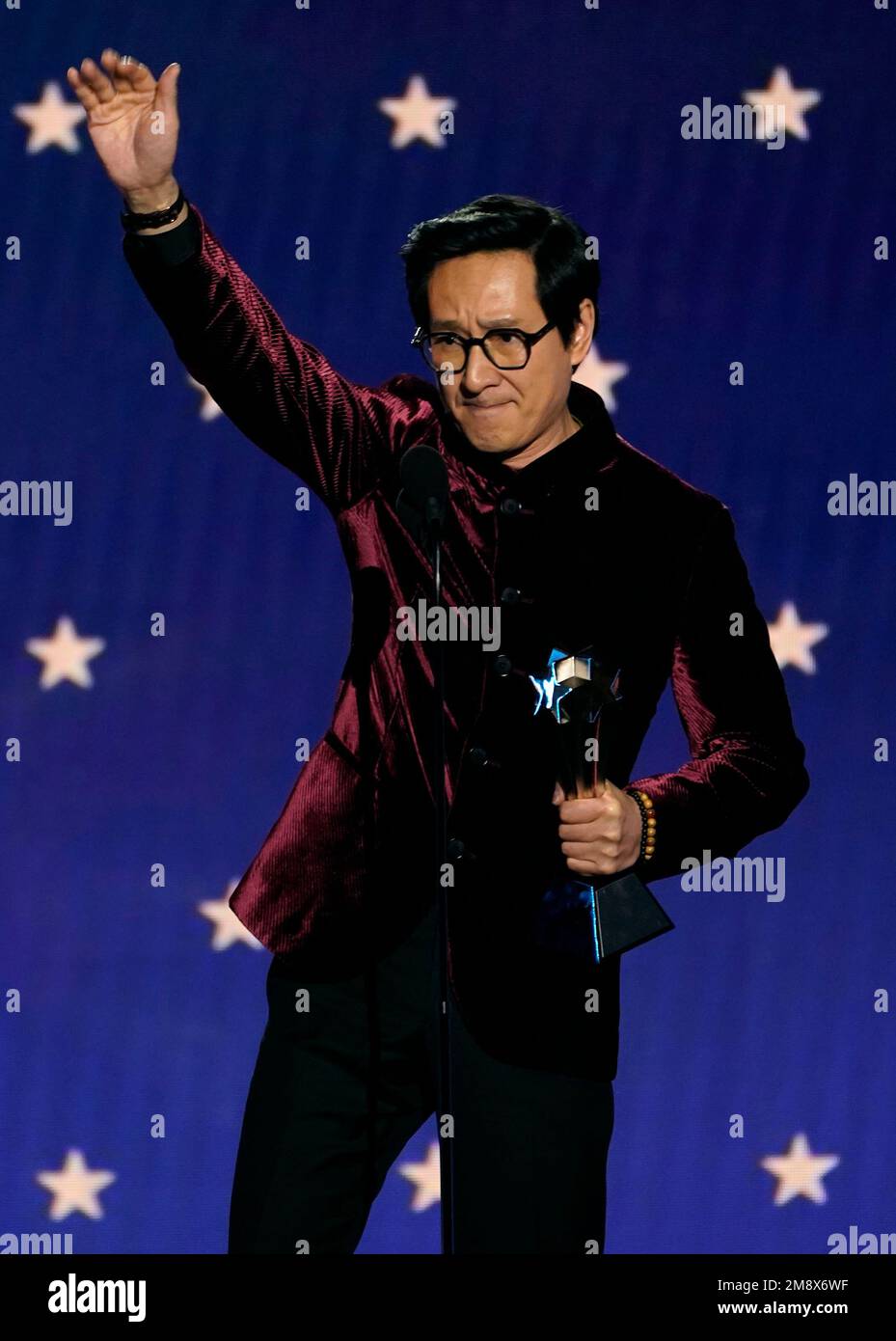 Ke Huy Quan accepts the award for best supporting actor for "Everything ...