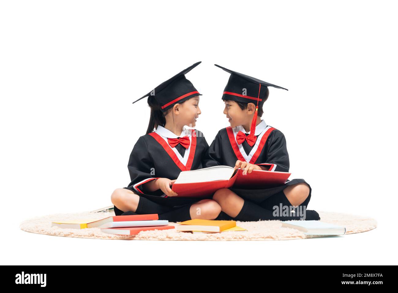 Children with a doctorial hat Stock Photo - Alamy