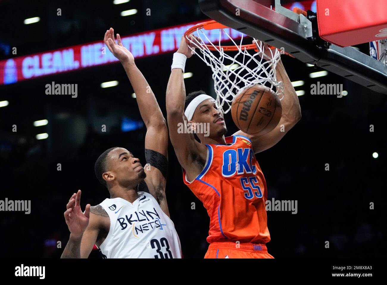 Oklahoma City Thunder's Darius Bazley (55) dunks the ball in front of ...