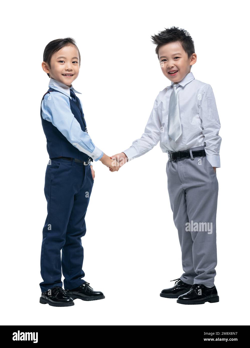 Two children shaking hands in hi-res stock photography and images - Alamy