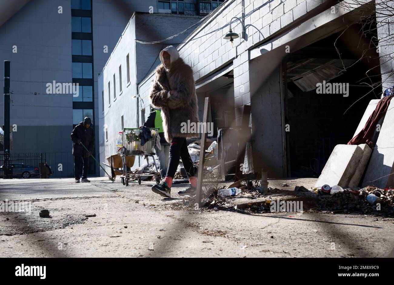 Atlanta, Georgia, USA. 15th Jan, 2023. A homeless couple tries to tidy ...