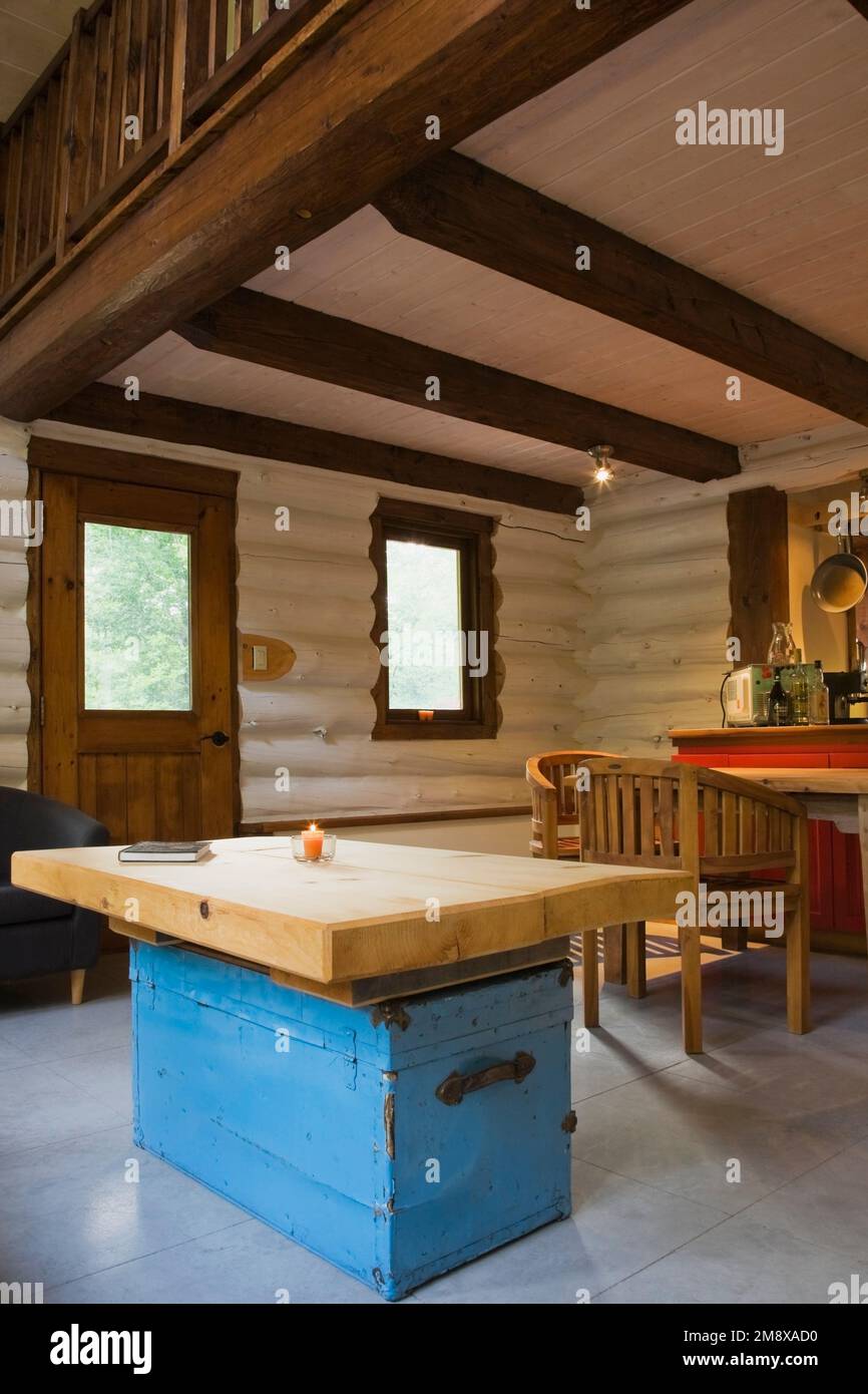 Blue chest with wooden countertop coffee table in living room and ...