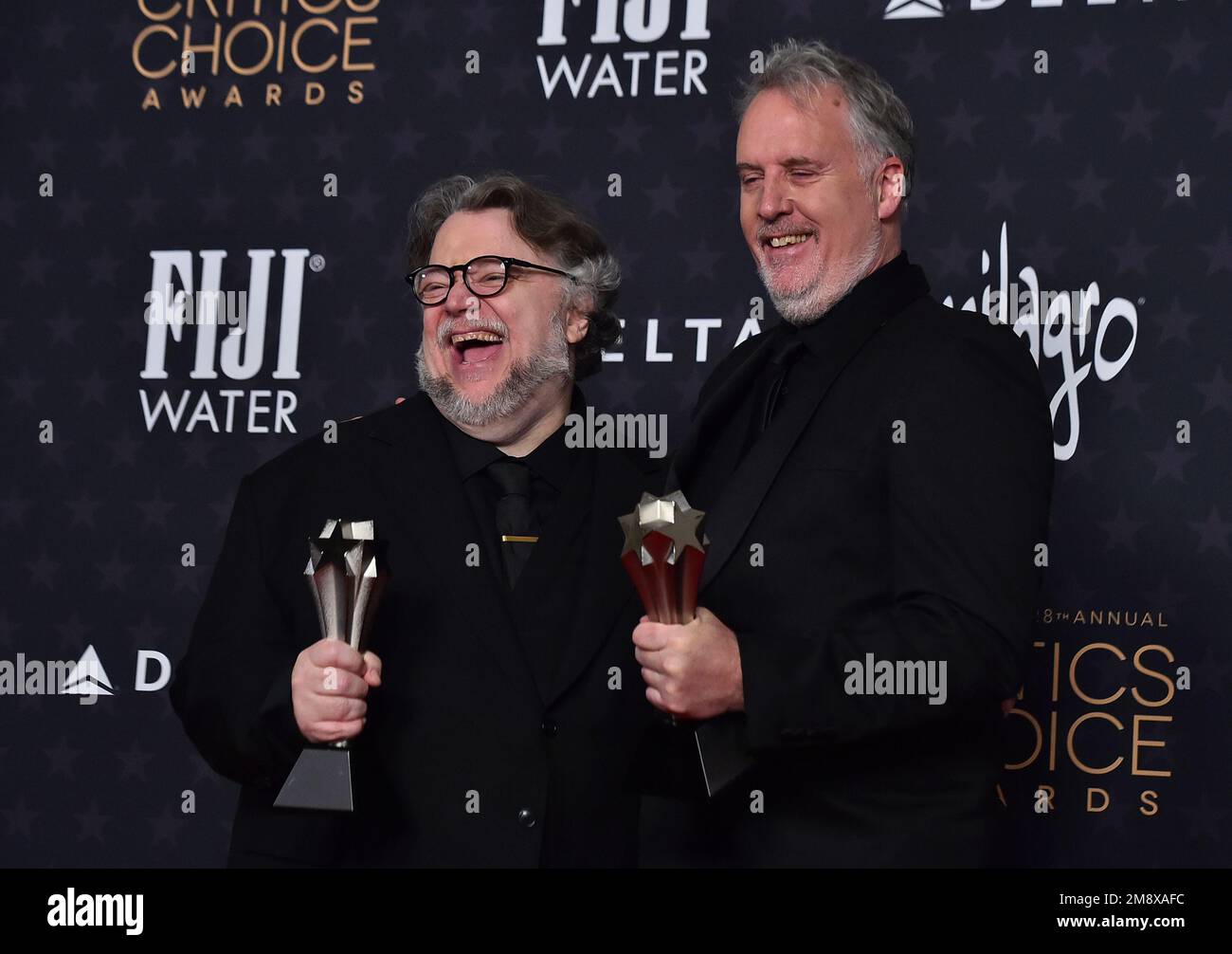 Guillermo del Toro, left, and Mark Gustafson pose in the press room ...