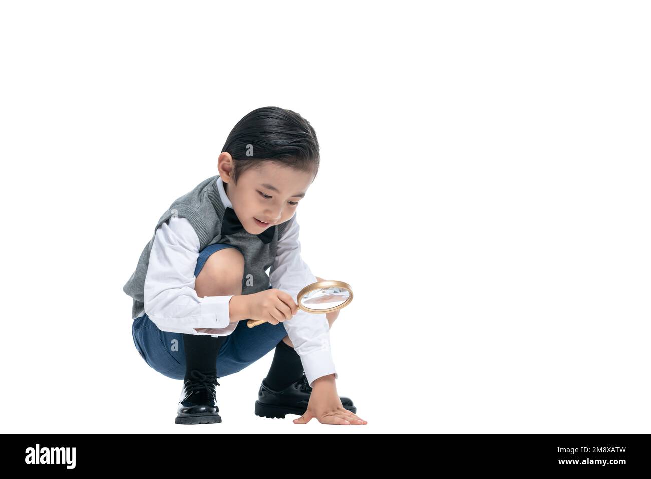 The little boy with a magnifying glass Stock Photo - Alamy