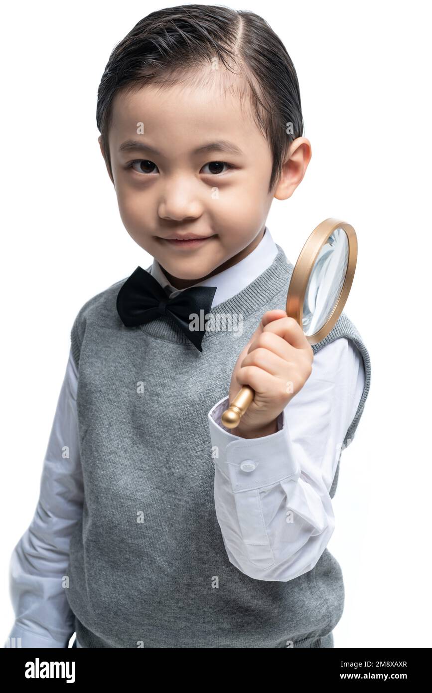 The little boy with a magnifying glass Stock Photo - Alamy