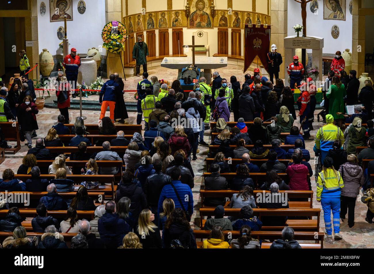 People seen praying at the church of the Mission. Worshippers pay ...