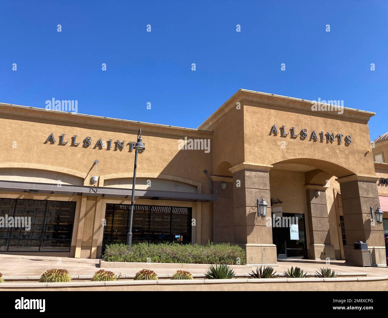 Allsaints sign, logo on the store facade at Desert Hills Premium ...