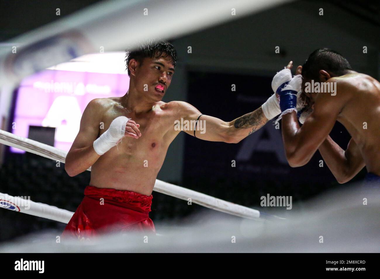 Yangon, Myanmar. 15th Jan, 2023. Nay Yine (L) of Myanmar fights with ...