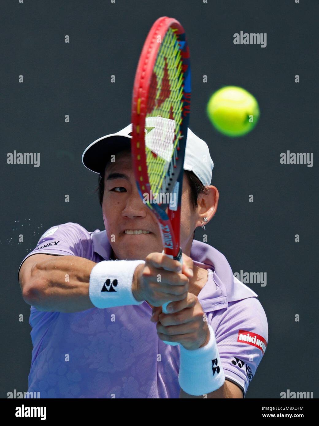 Yoshihito Nishioka of Japan plays a backhand return to Mikael Ymer of ...