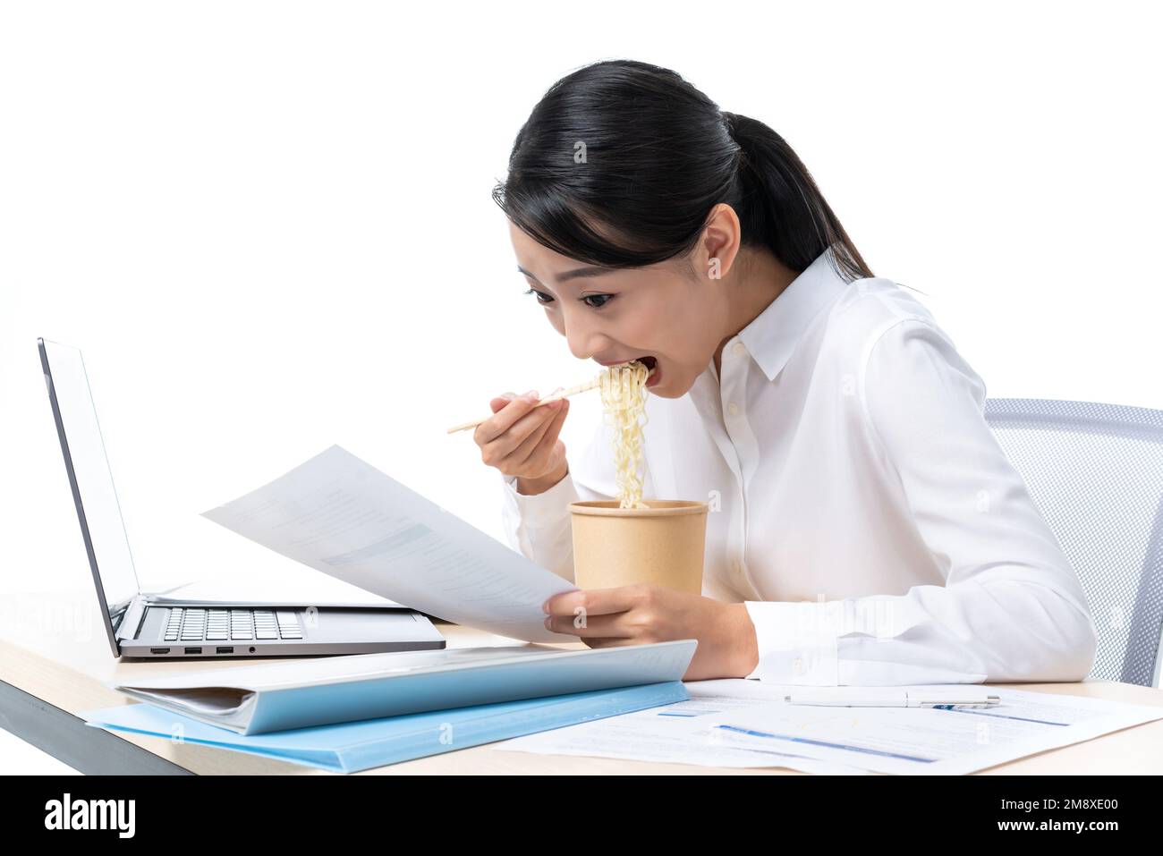 Young business lady eat fast food Stock Photo - Alamy