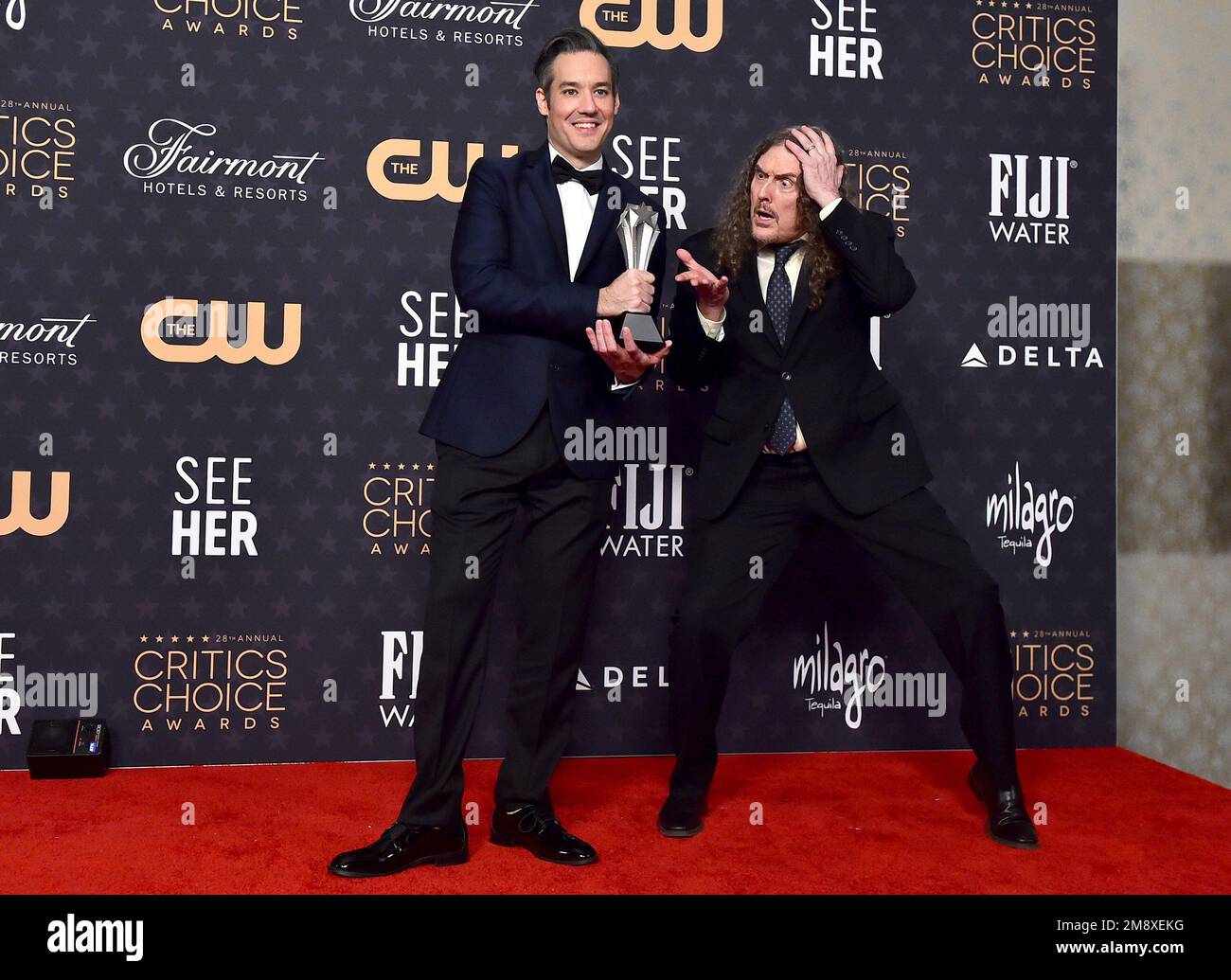 Eric Appel, left, and "Weird" Al Yankovic pose with the award for best ...